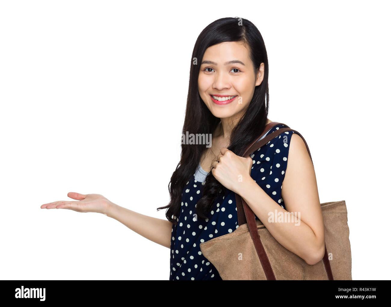 Young woman wear a shoulder bag and open hand palm Stock Photo - Alamy