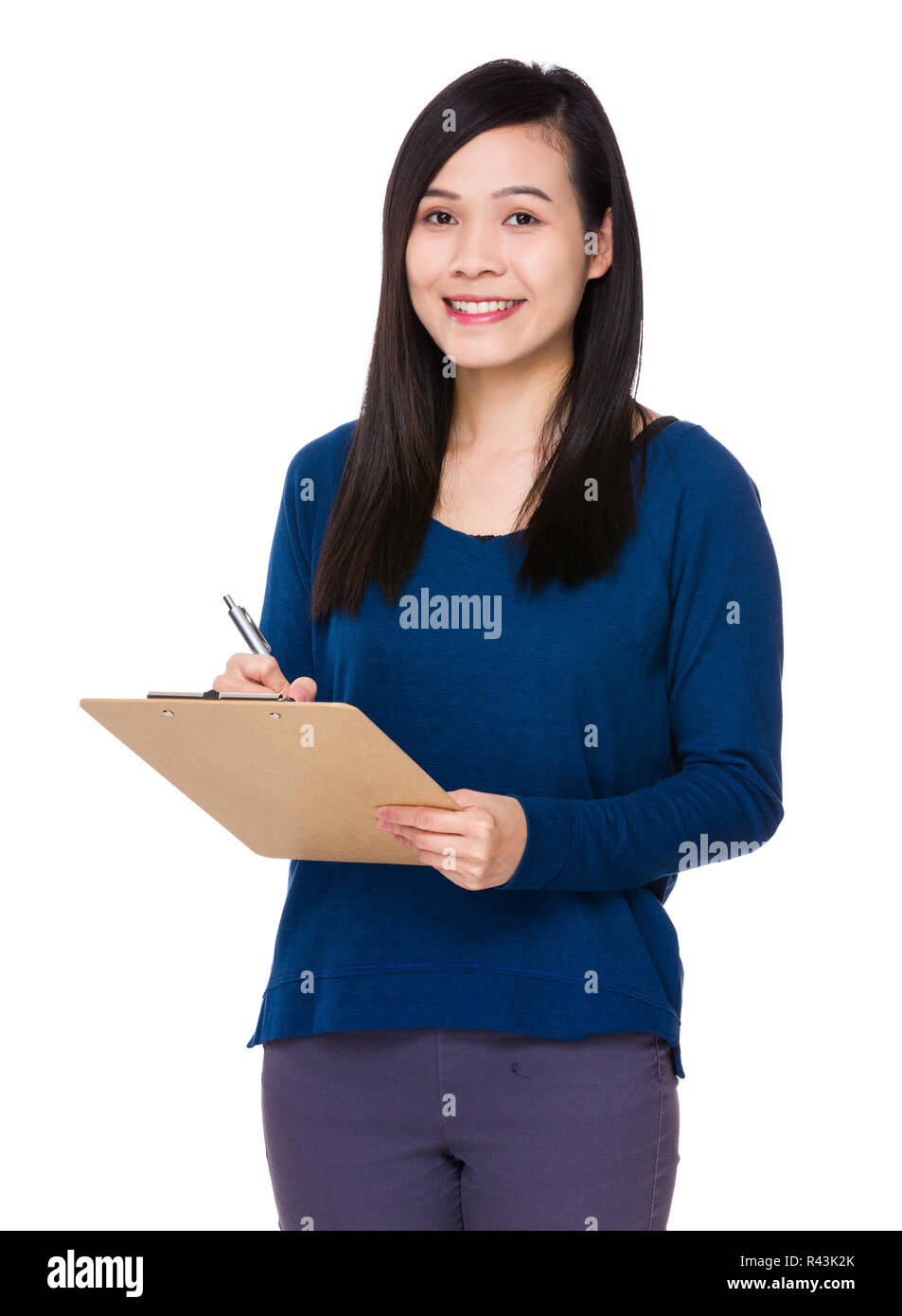 Young woman take note on clipboard Stock Photo - Alamy