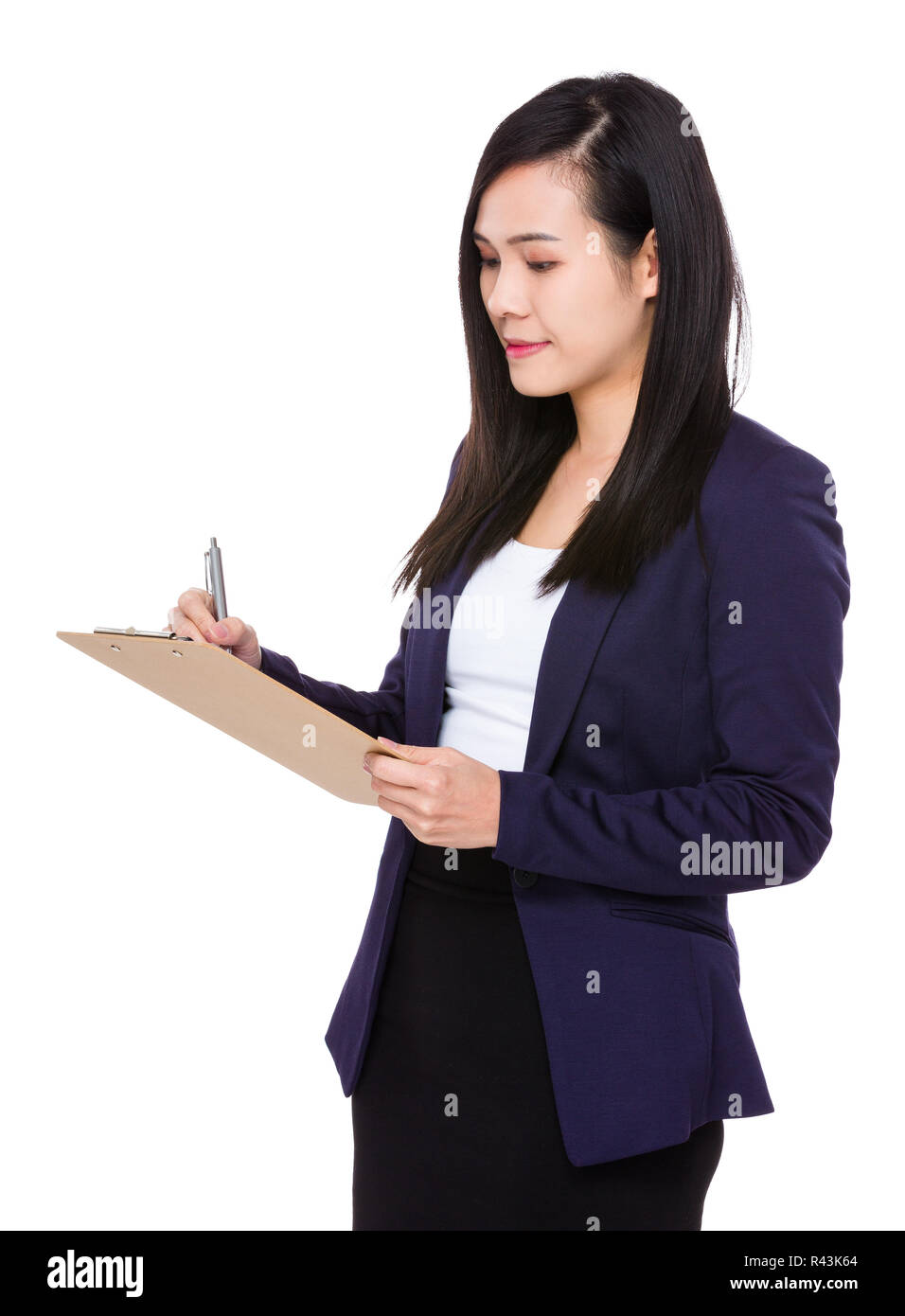 Asian Businesswoman take note on clipboard Stock Photo - Alamy