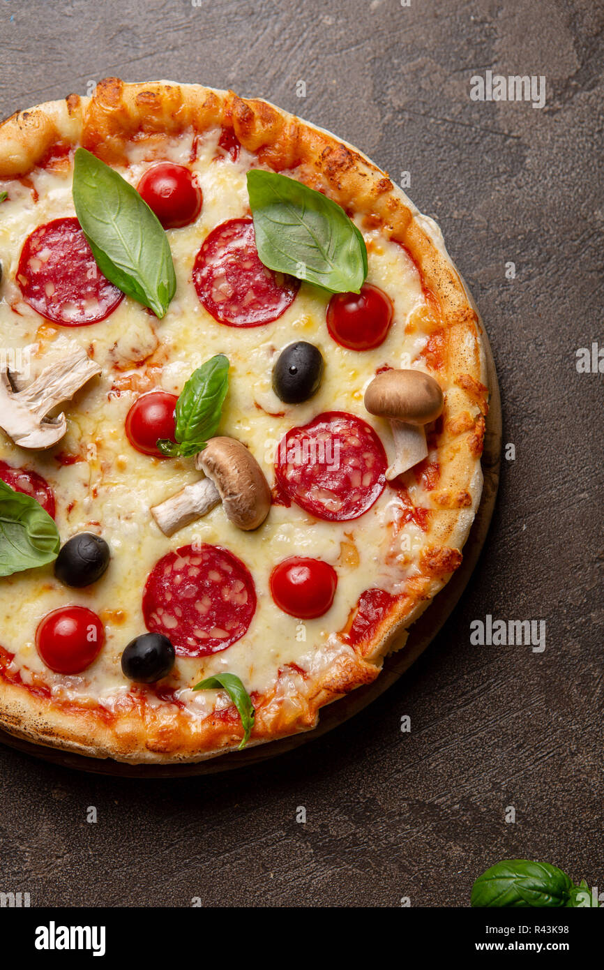 Pizza with pepperoni and mushrooms Stock Photo - Alamy