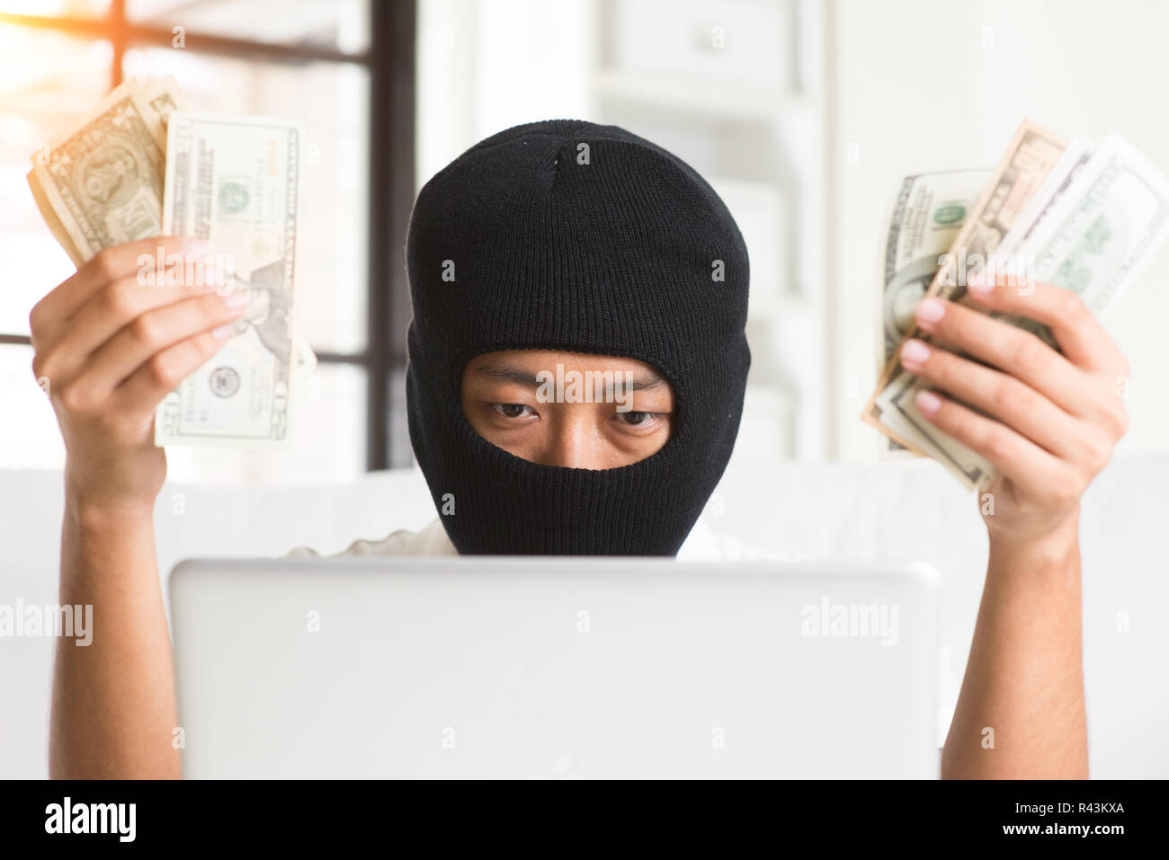hacker and cash Stock Photo - Alamy