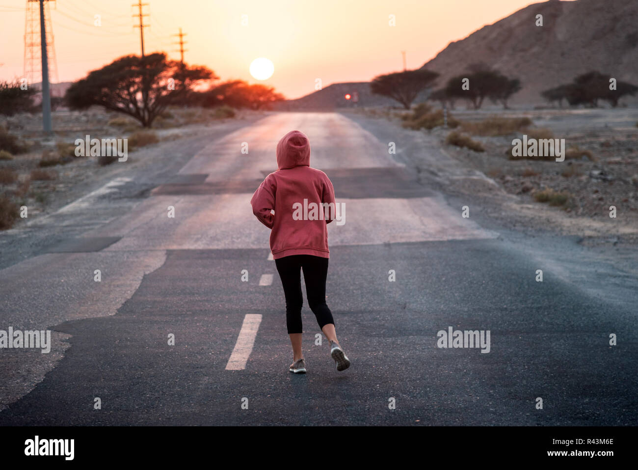 Running in sunset hi-res stock photography and images - Alamy