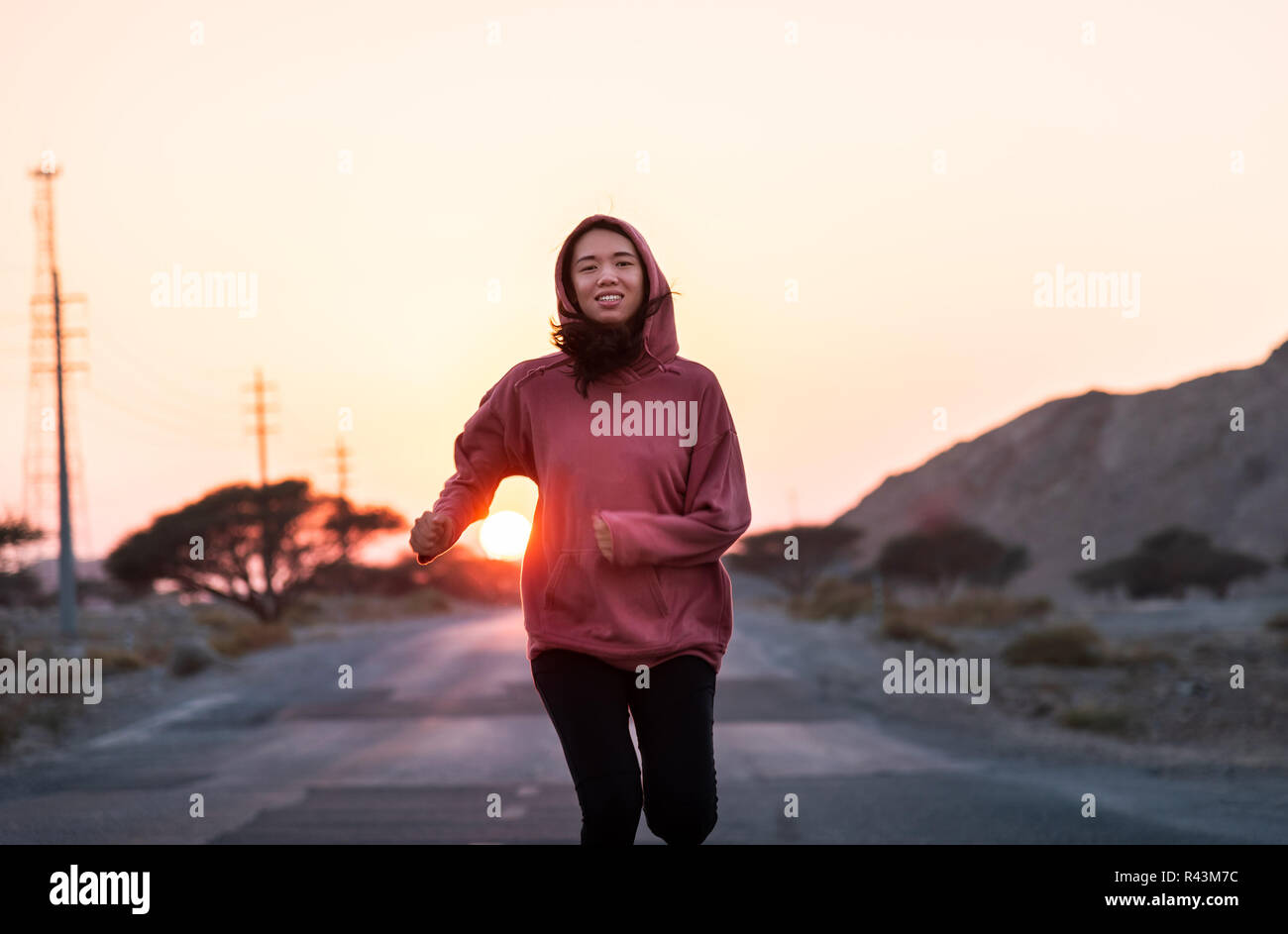 Running in sunset hi-res stock photography and images - Alamy