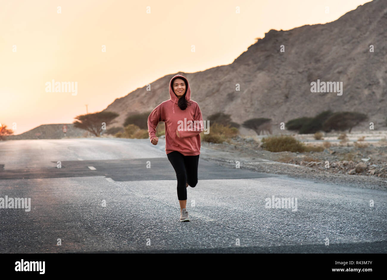 Running in sunset hi-res stock photography and images - Alamy