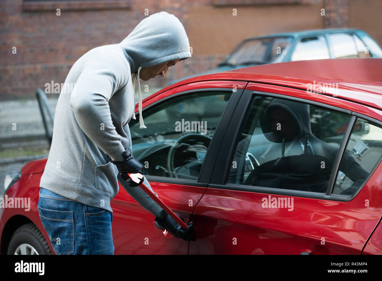 Thief Using Crowbar To Open Car s Door Stock Photo Alamy