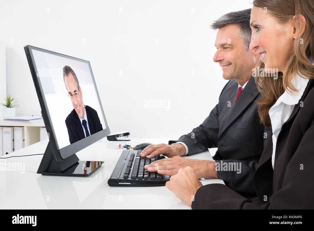 Two Businesspeople In Video Conference Stock Photo - Alamy