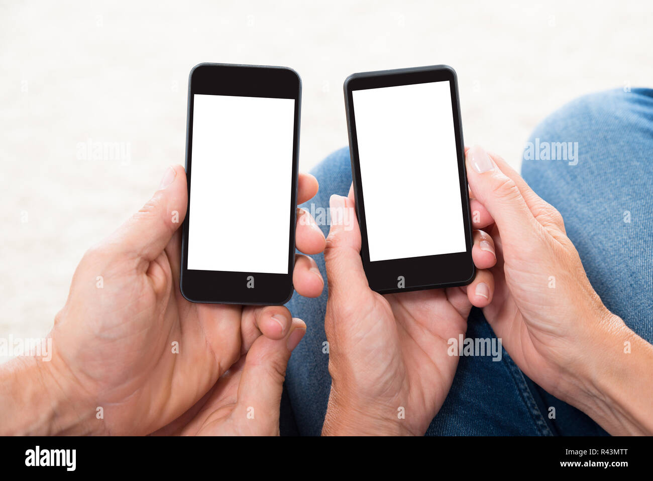 Two People Hands Holding Mobile Phones Stock Photo - Alamy