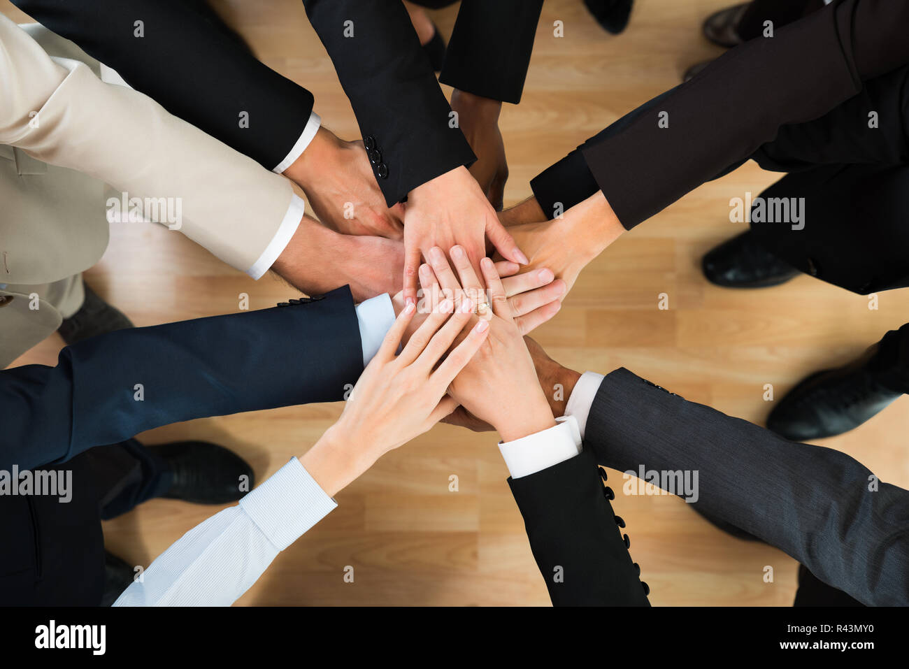 Team huddle hands above hi-res stock photography and images - Alamy