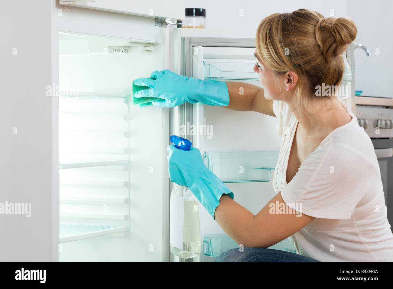 Woman Cleaning Refrigerator At Home Stock Photo - Alamy