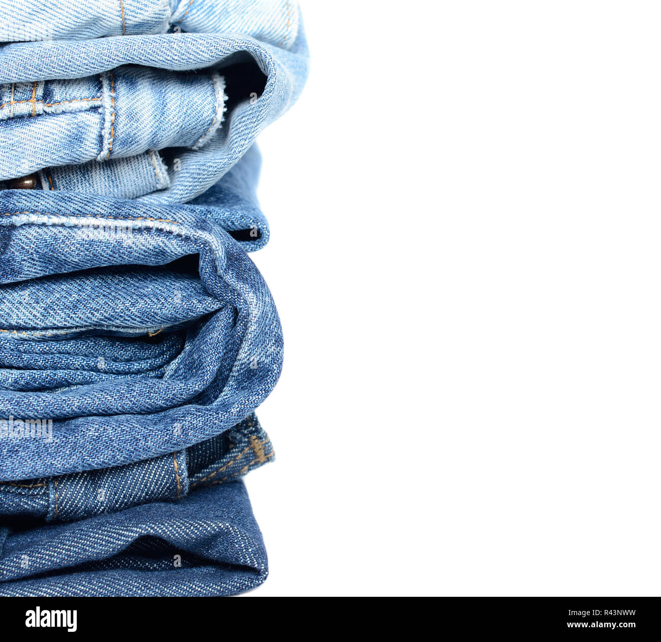 Stack of jeans isolated on white Stock Photo - Alamy