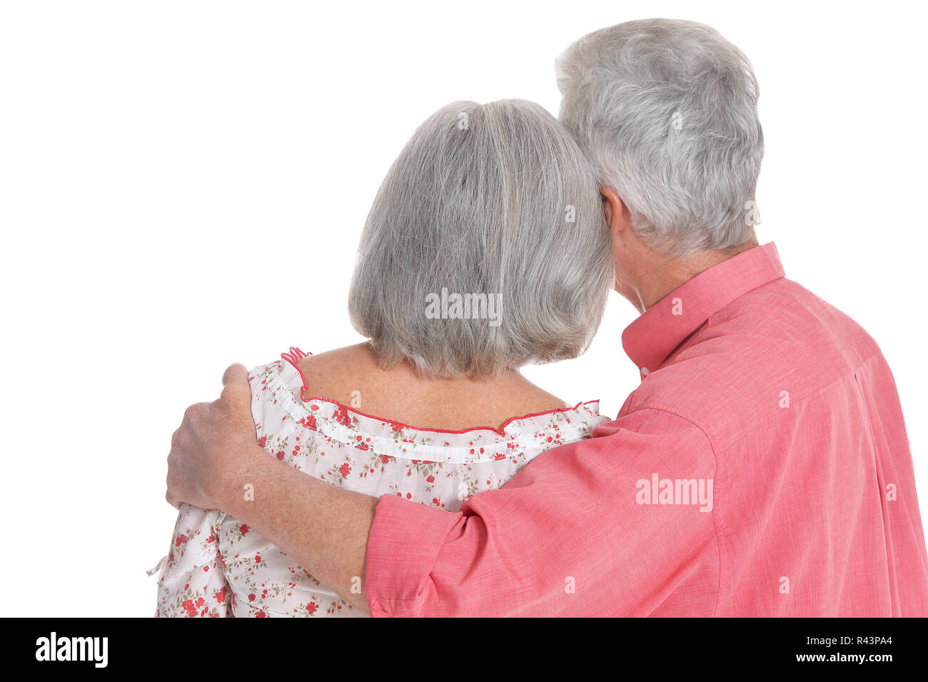 Rear view of senior couple hugging on white background Stock Photo - Alamy