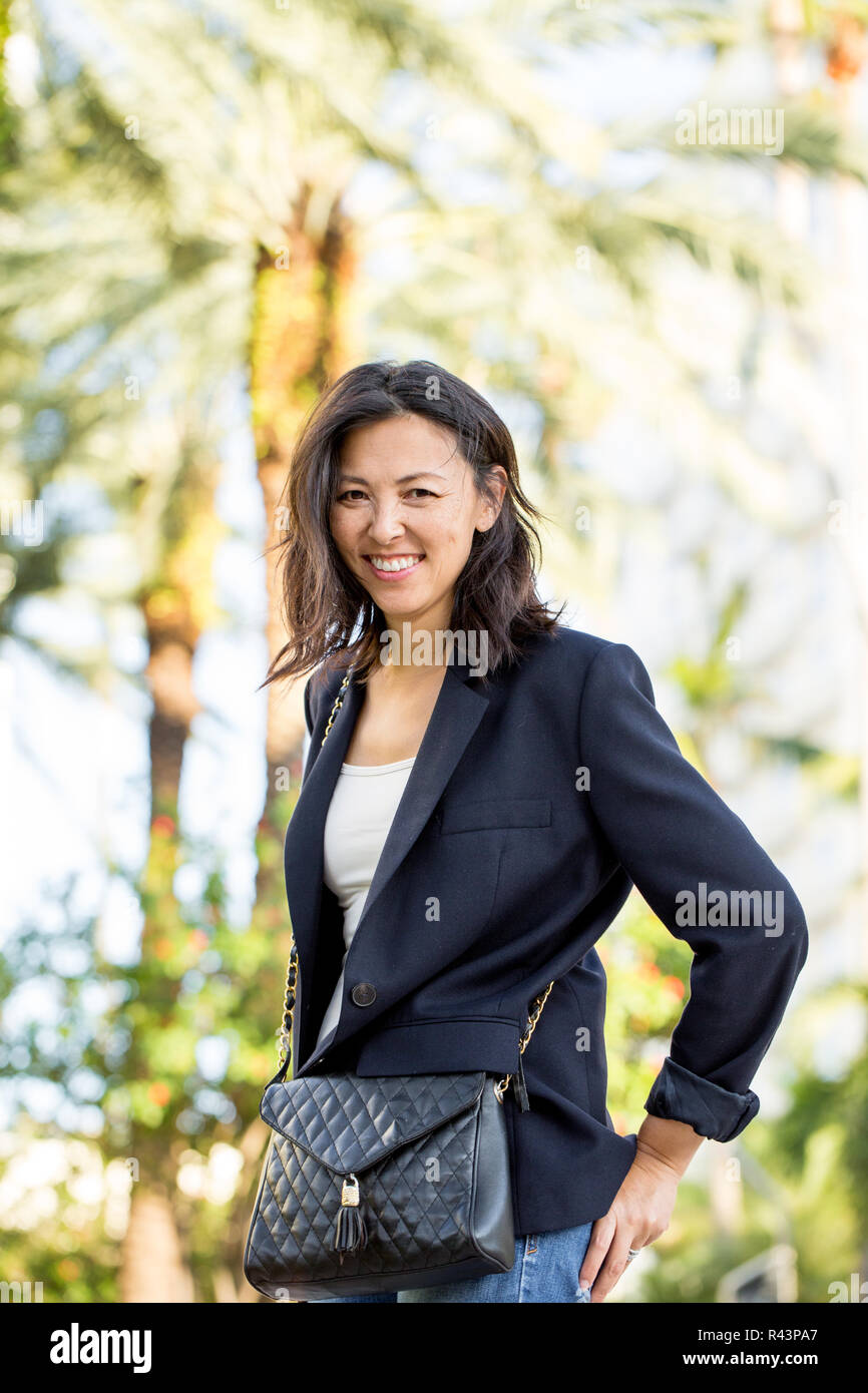 Portrait of a friendly Asian woman smiling Stock Photo - Alamy