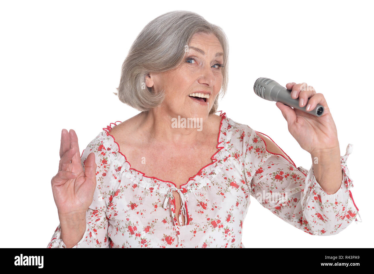 Senior singer woman portrait on white background Stock Photo - Alamy