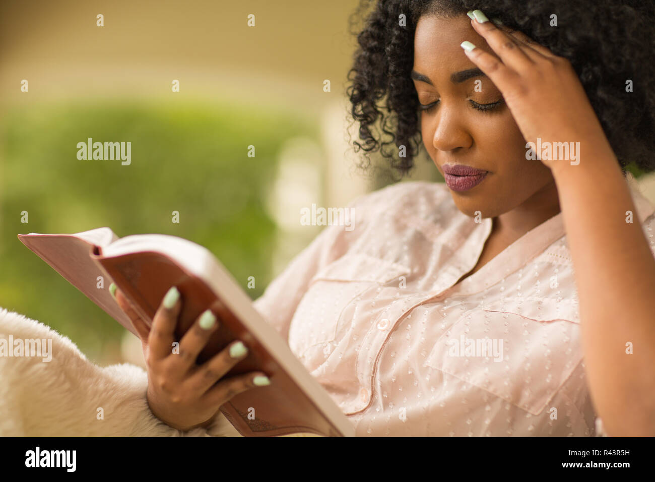 African American woman studing and reading the Bible Stock Photo - Alamy