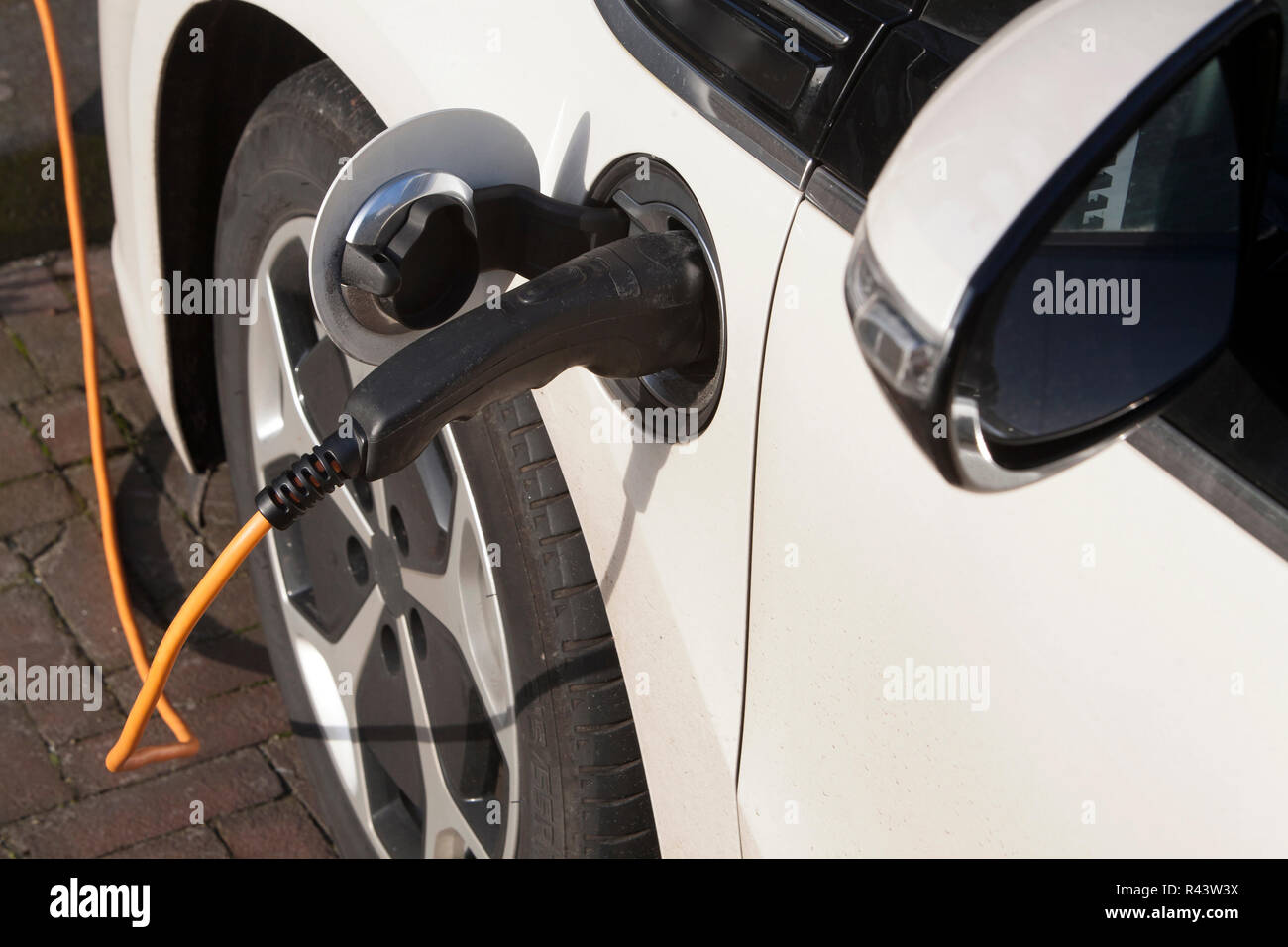 Electric car charging Stock Photo - Alamy