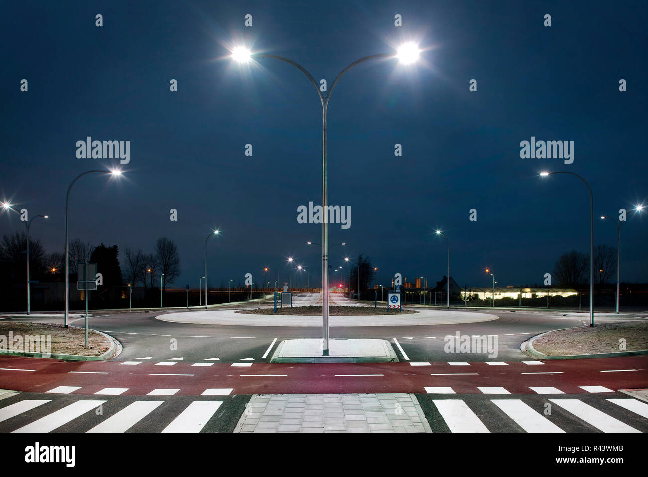 Roundabout illuminated by LED lights at twilight Stock Photo - Alamy