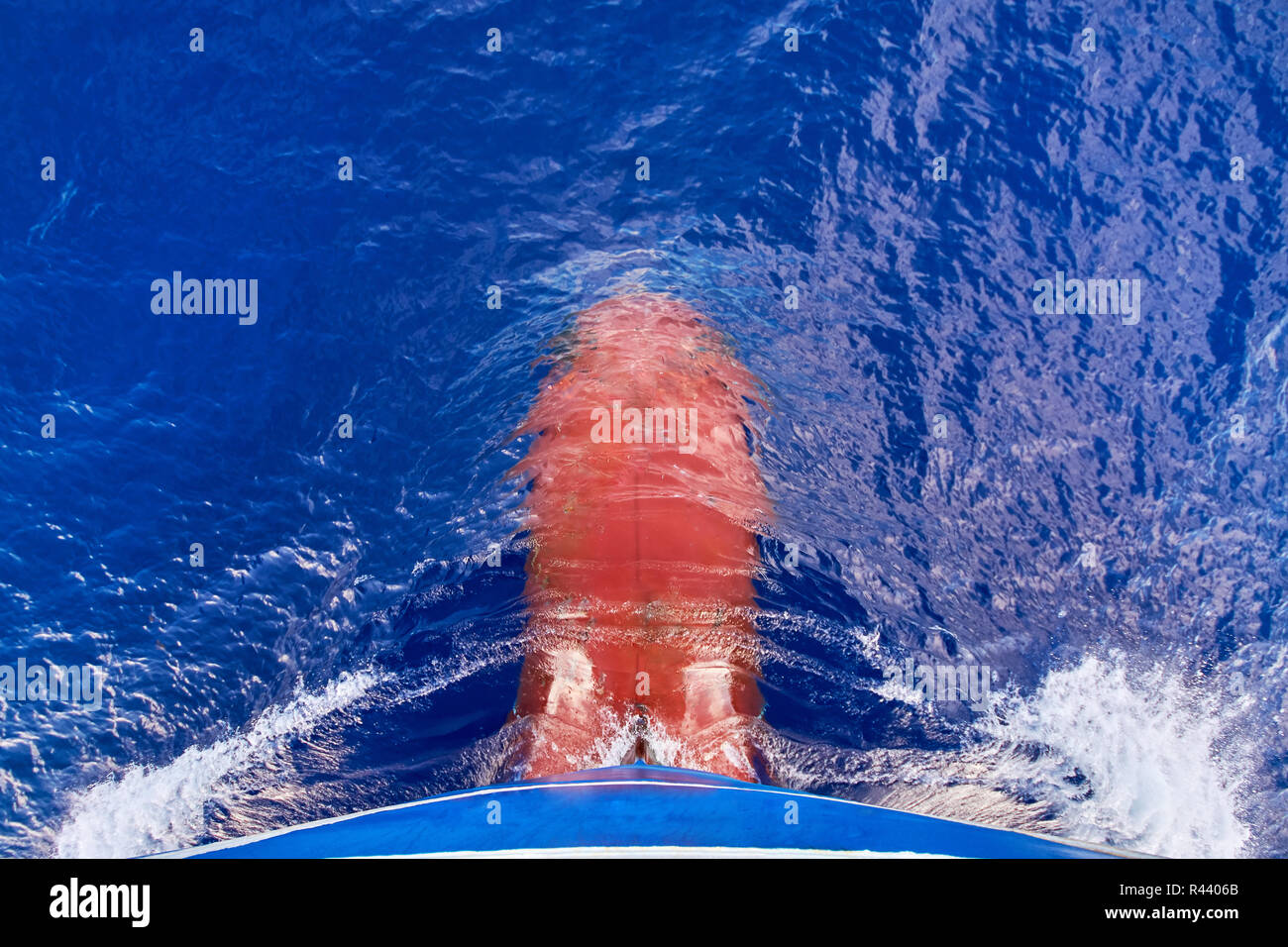 Big Cargo ship sailing in the sea in crystal clean water to Logistics ...