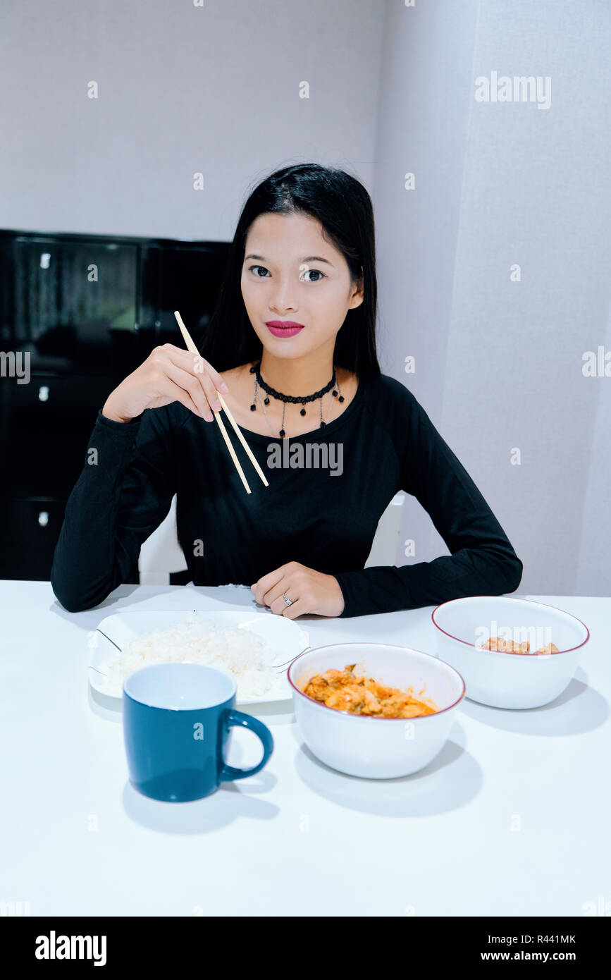 Beautiful woman posing - eating, sitting, smiling face Stock Photo - Alamy