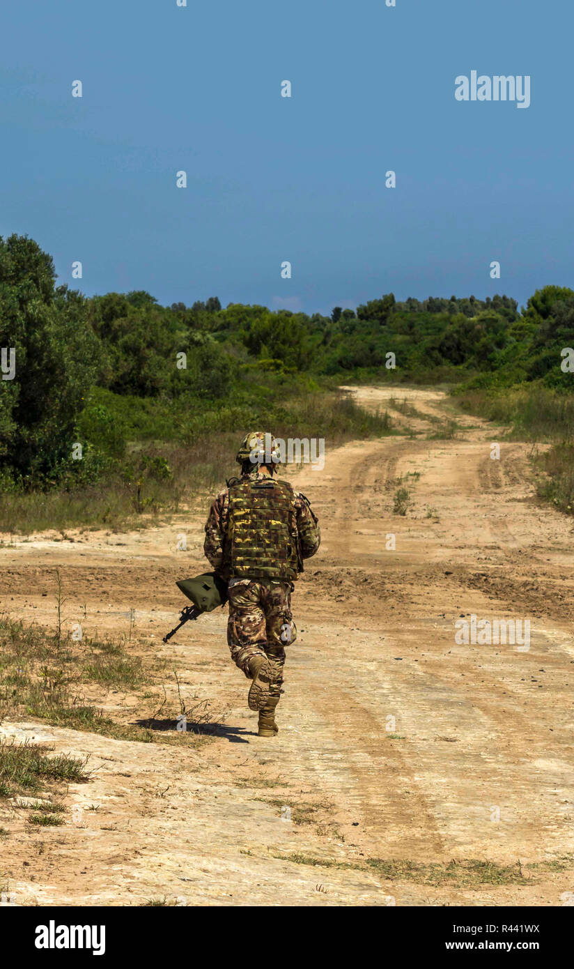 the soldier runs into the path Stock Photo - Alamy