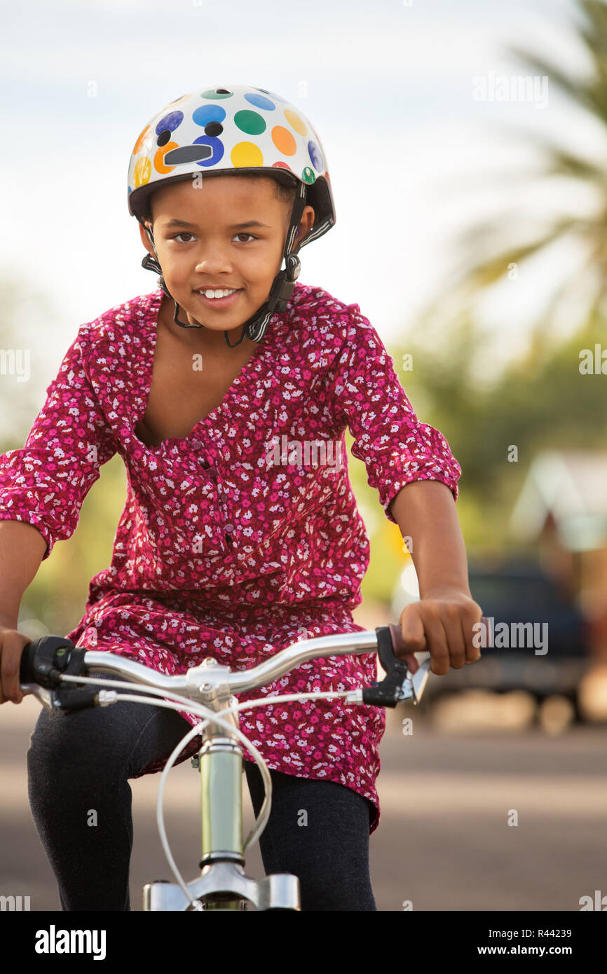 Happy Girl Riding Bike Stock Photo - Alamy
