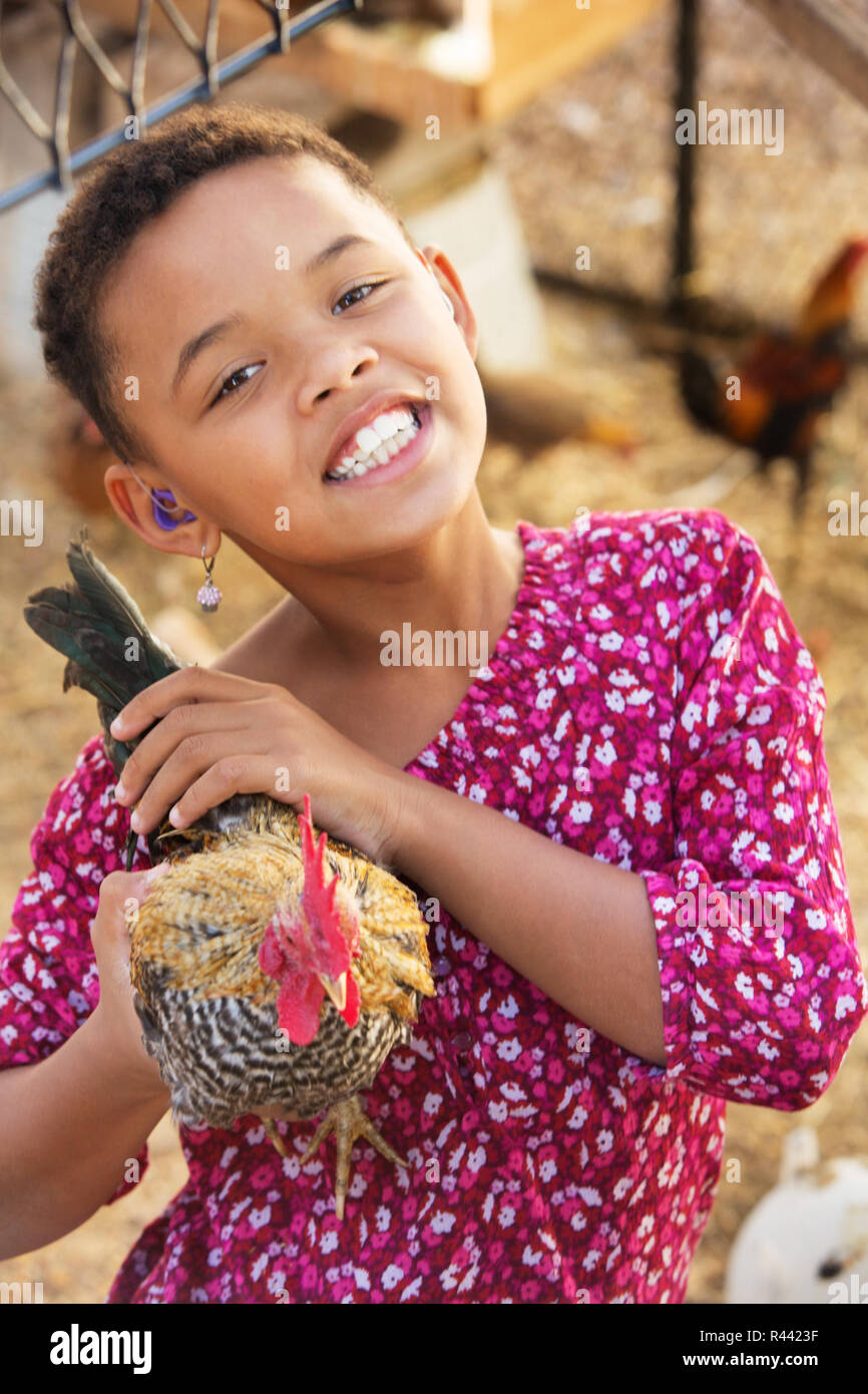 Cute Child with Hen Stock Photo - Alamy