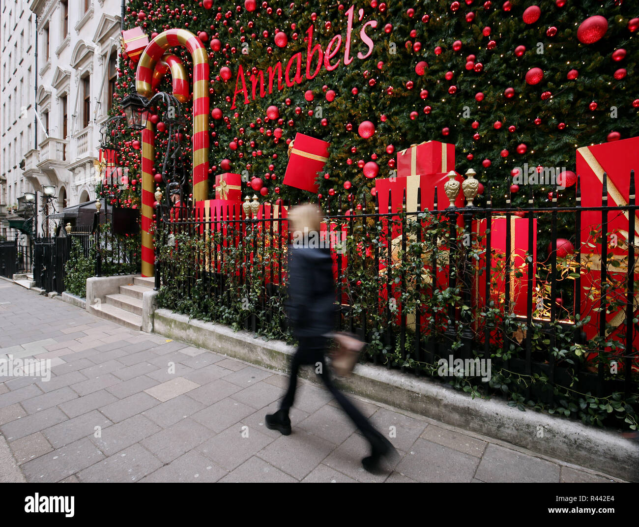 A pedestrian makes her way past Annabel's, Berkeley Square, London ...