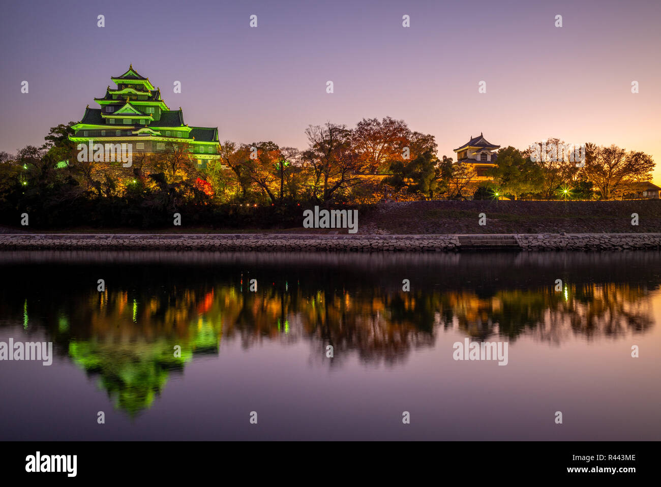 night view of Okayama Castle by river asahi in japan Stock Photo - Alamy