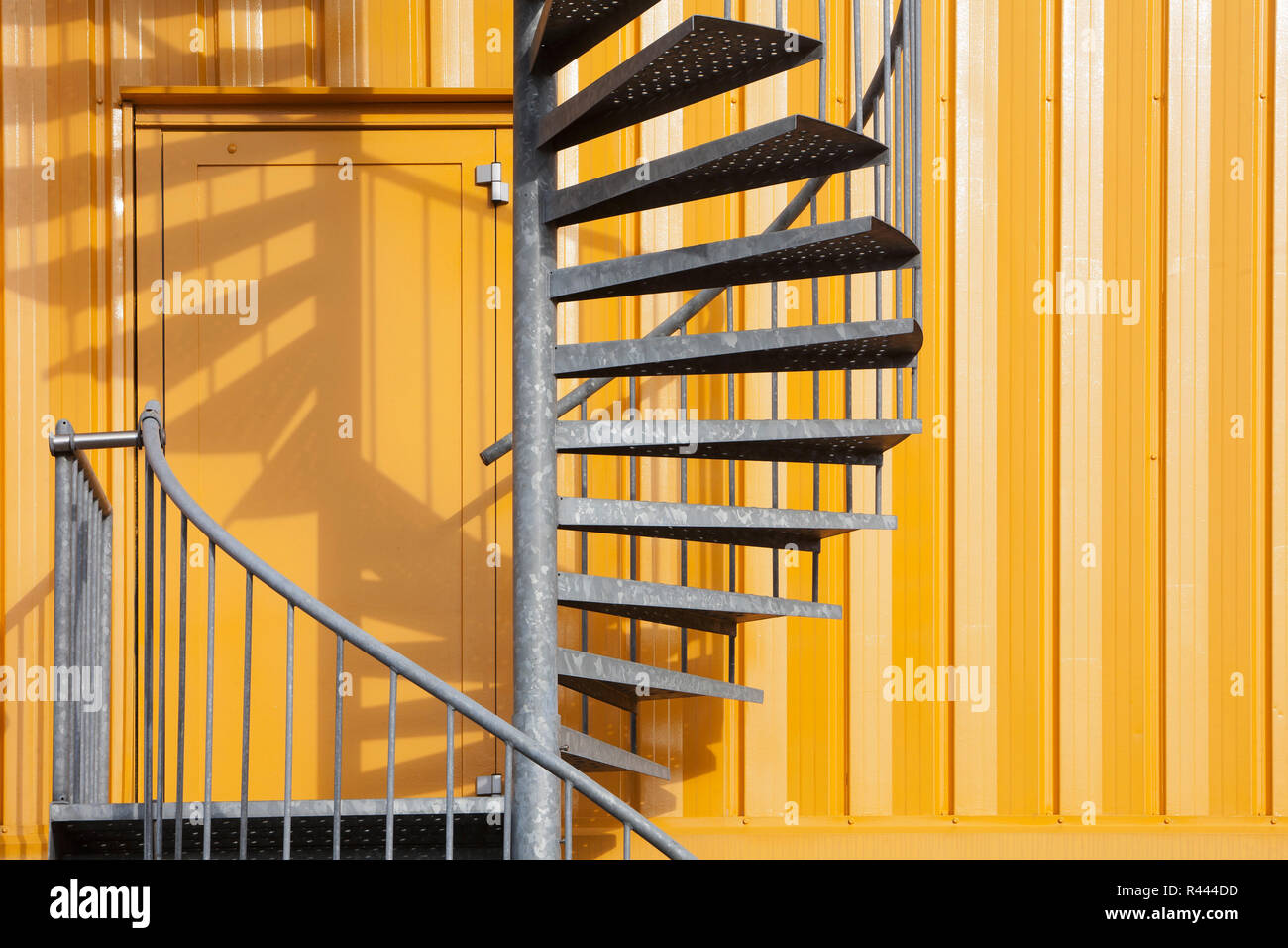 Yellow spiral staircase Stock Photo - Alamy