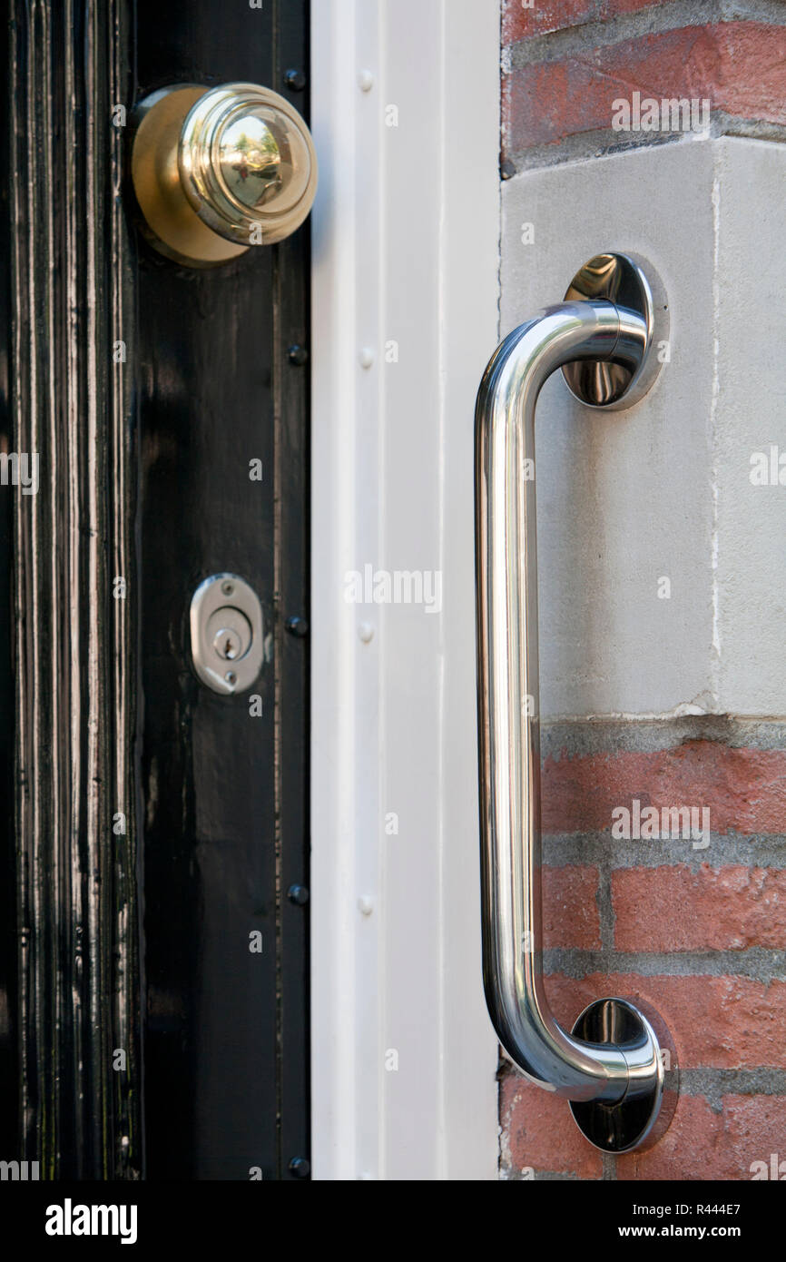 Safety grab handle near a door Stock Photo - Alamy