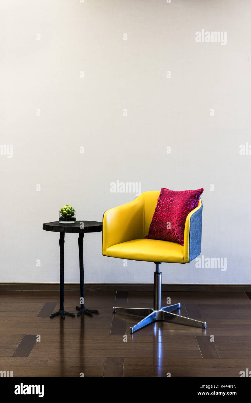 Table Chair combination in front of a plain wall Stock Photo - Alamy
