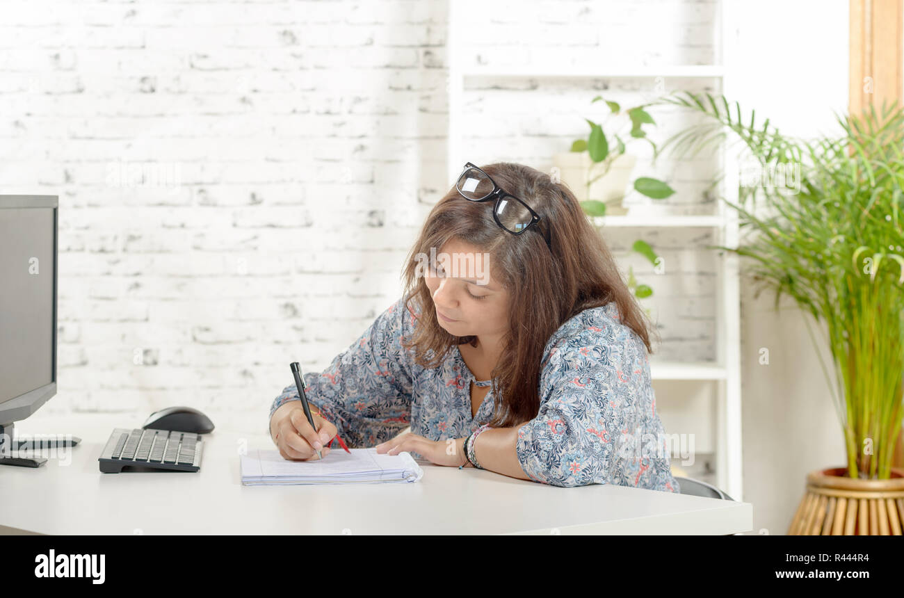 girl student working on his homework Stock Photo - Alamy