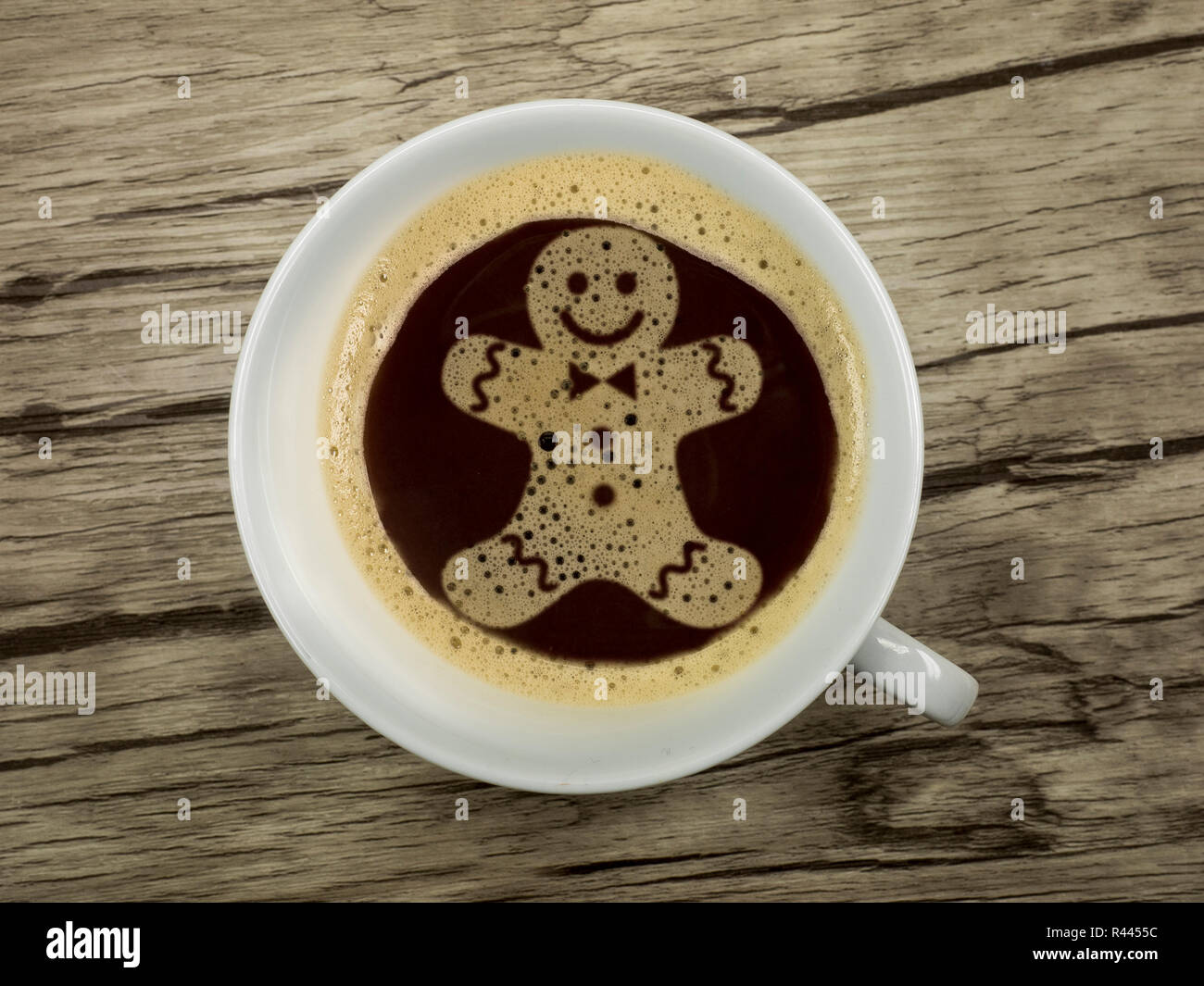 gingerbread man in the coffee cup Stock Photo - Alamy