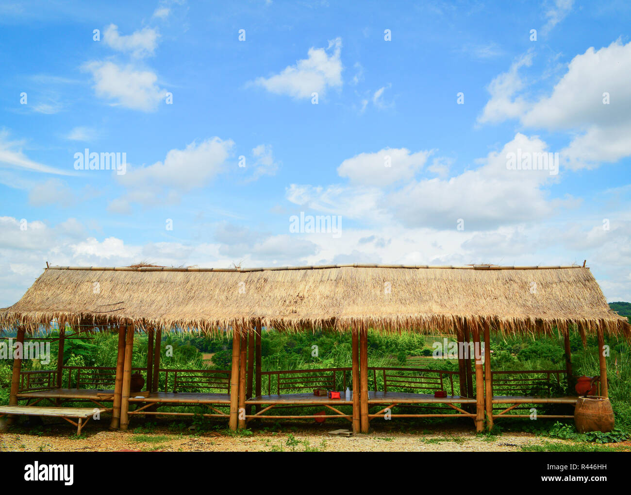 rustic hut with roof dry grass blue sky background - countryside ...
