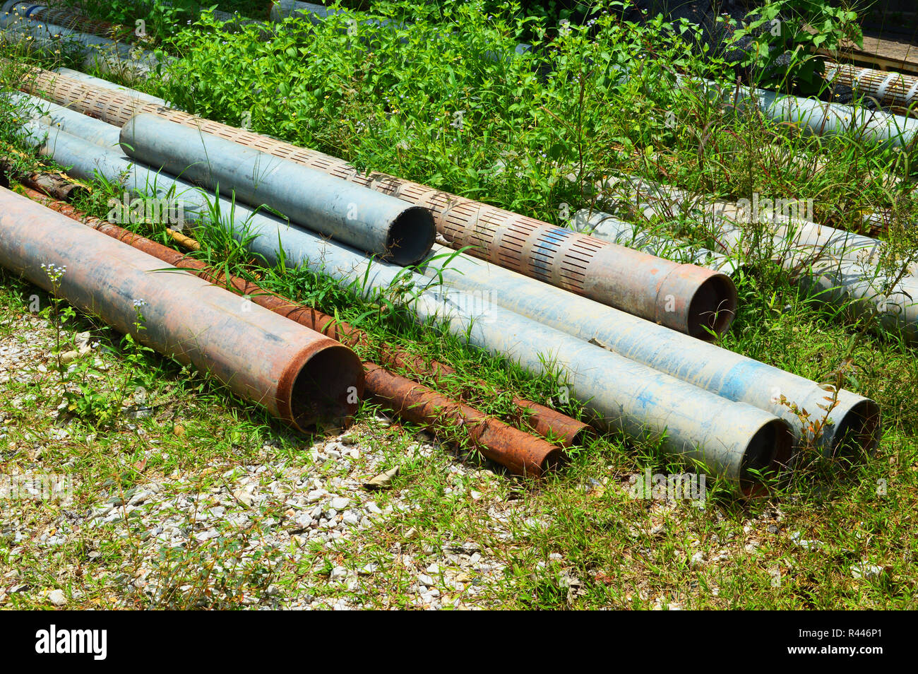 old steel pipe with rusty at building construction site factory / pile ...