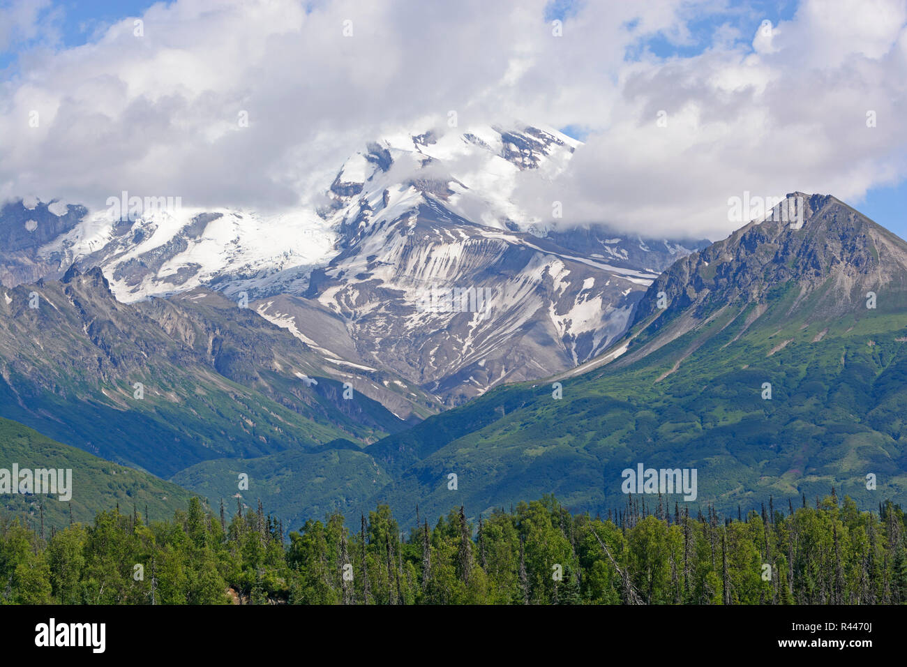 Volcanic Mountain Peeking Through the Clouds Stock Photo - Alamy