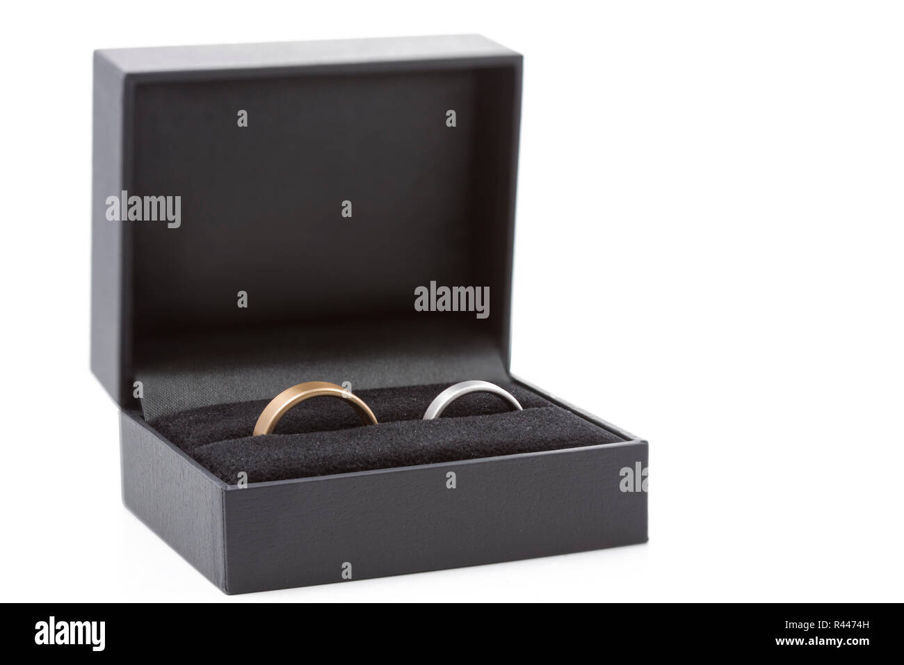 two wedding rings in black box isolated Stock Photo - Alamy
