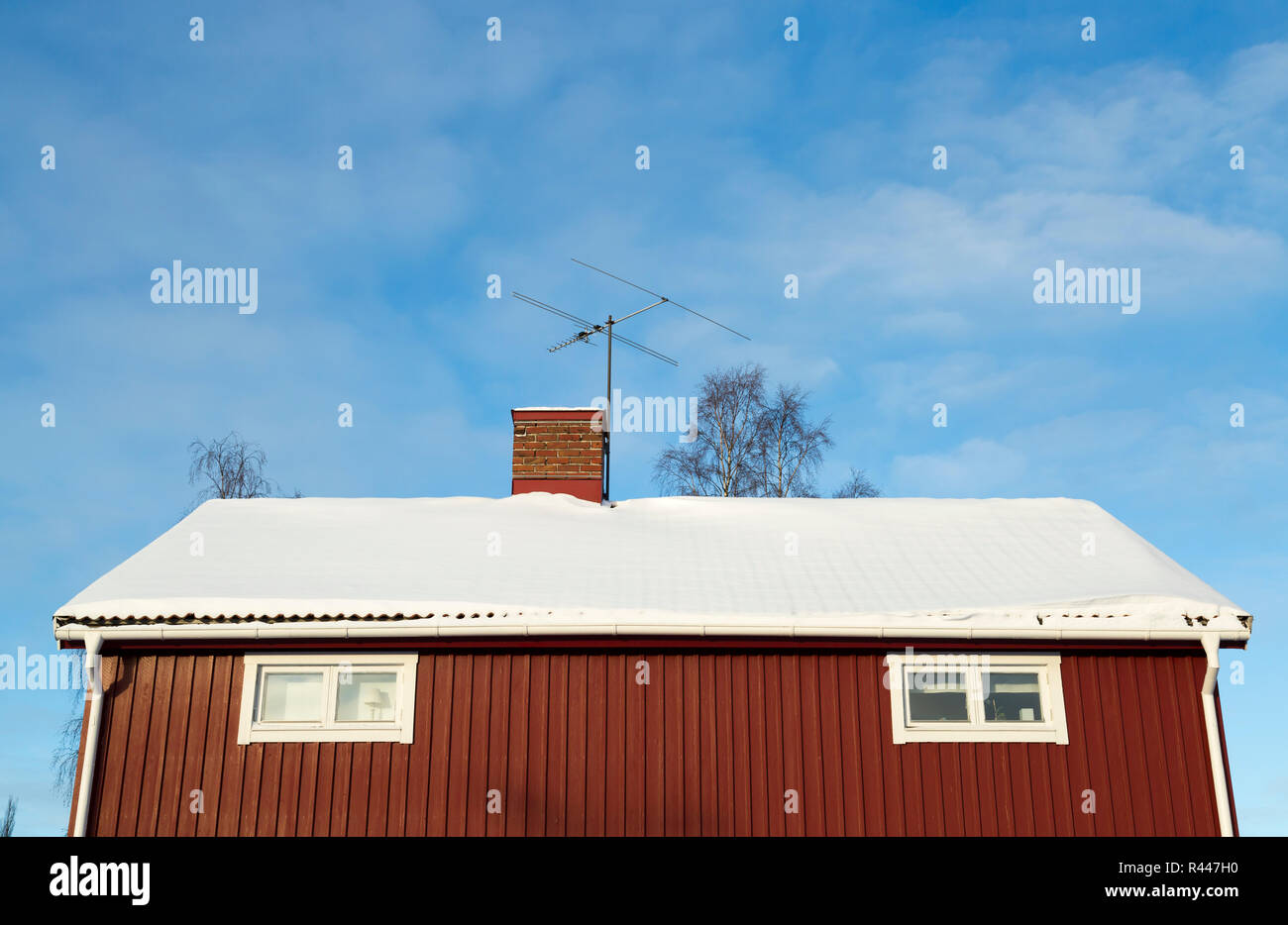 Red House With Snow on the Roof Stock Photo - Alamy