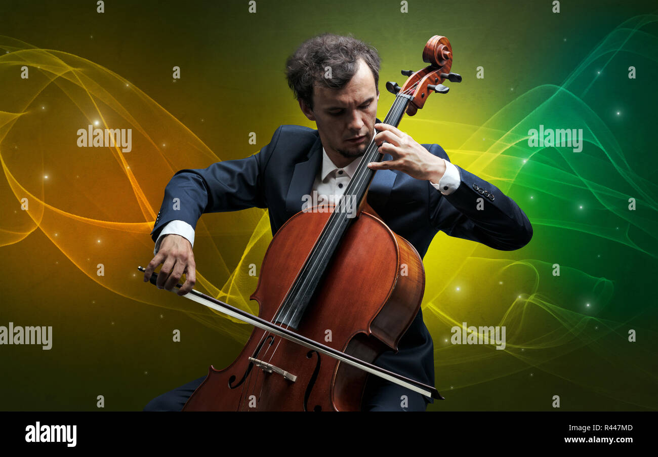 Serious classical cellist with fabled sparkling wallpaper Stock Photo ...