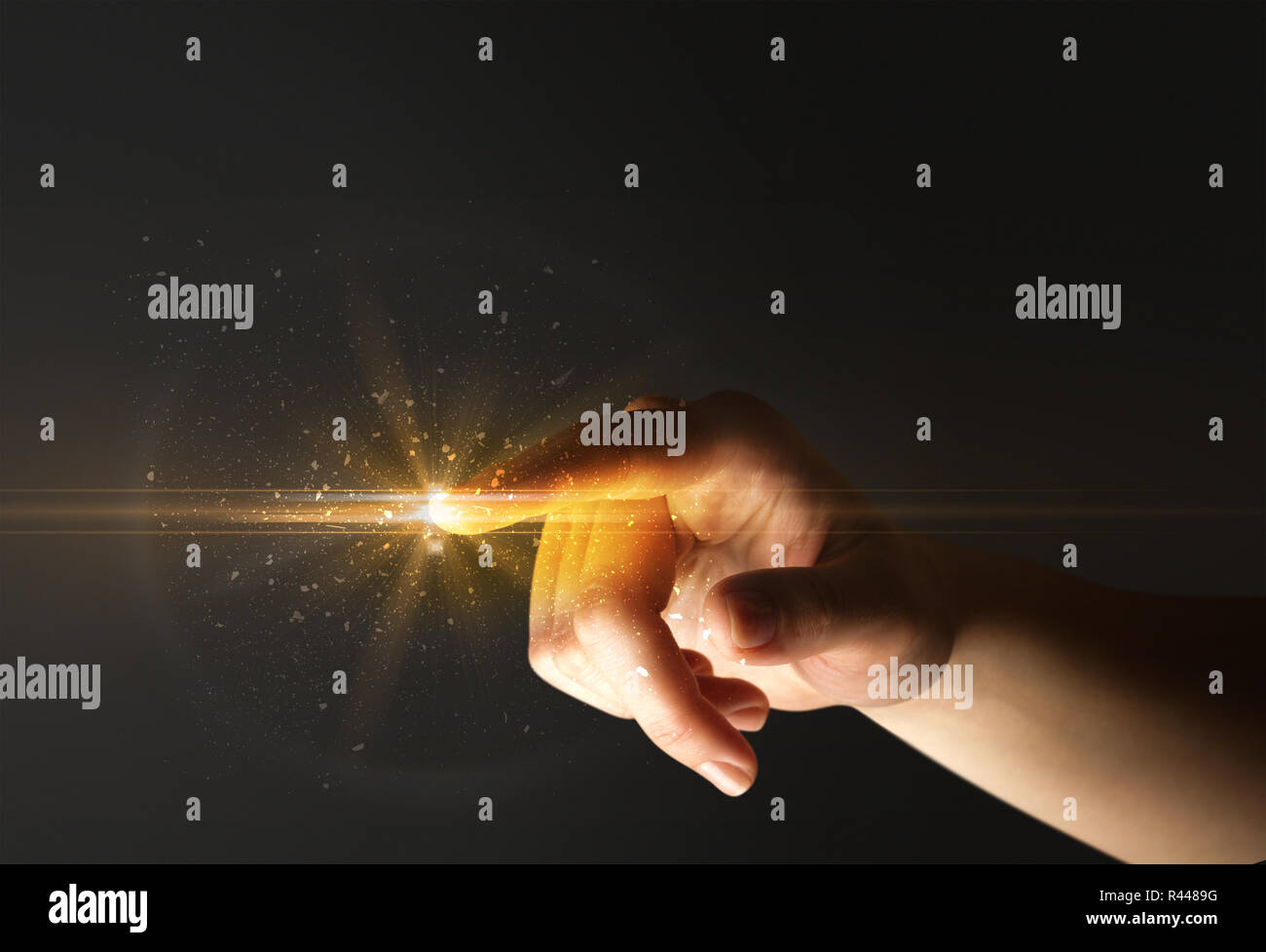 Female finger touching a beam of light Stock Photo - Alamy