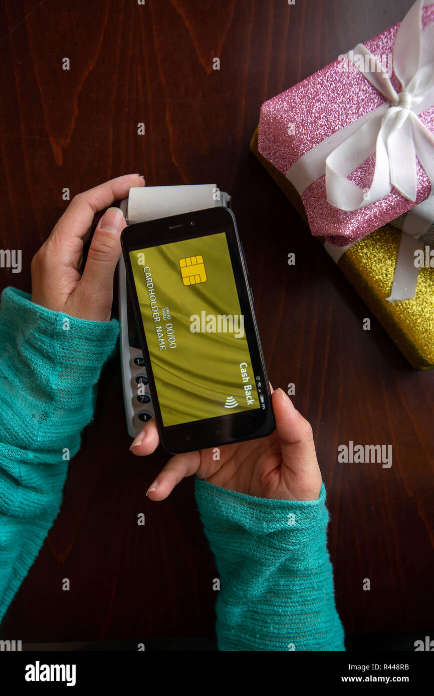 Photo on top of hands of human, smartphone, terminal terminal, boxes ...