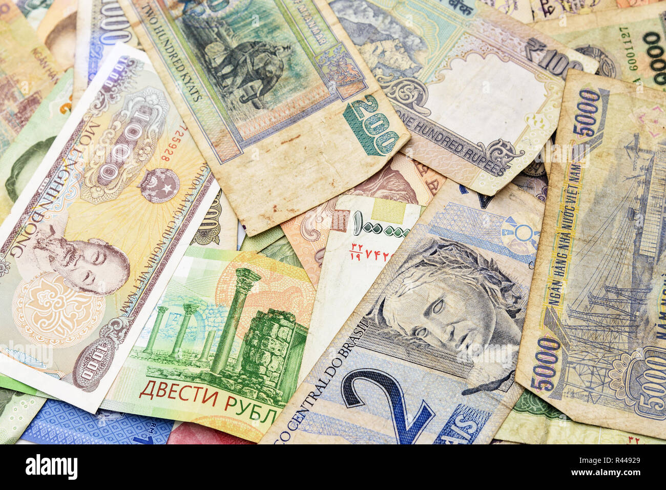 Cash money from different countries background Stock Photo - Alamy