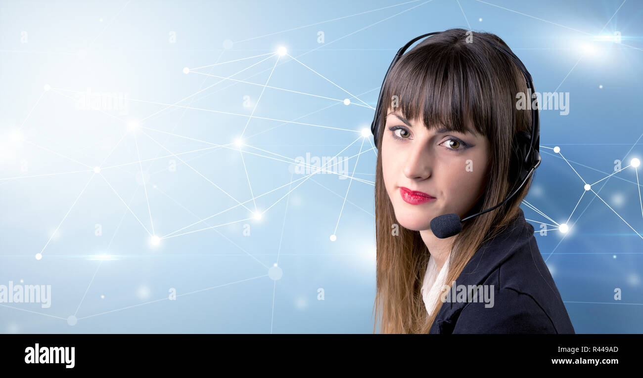 Young female telemarketer with blue background and connectivity concept ...