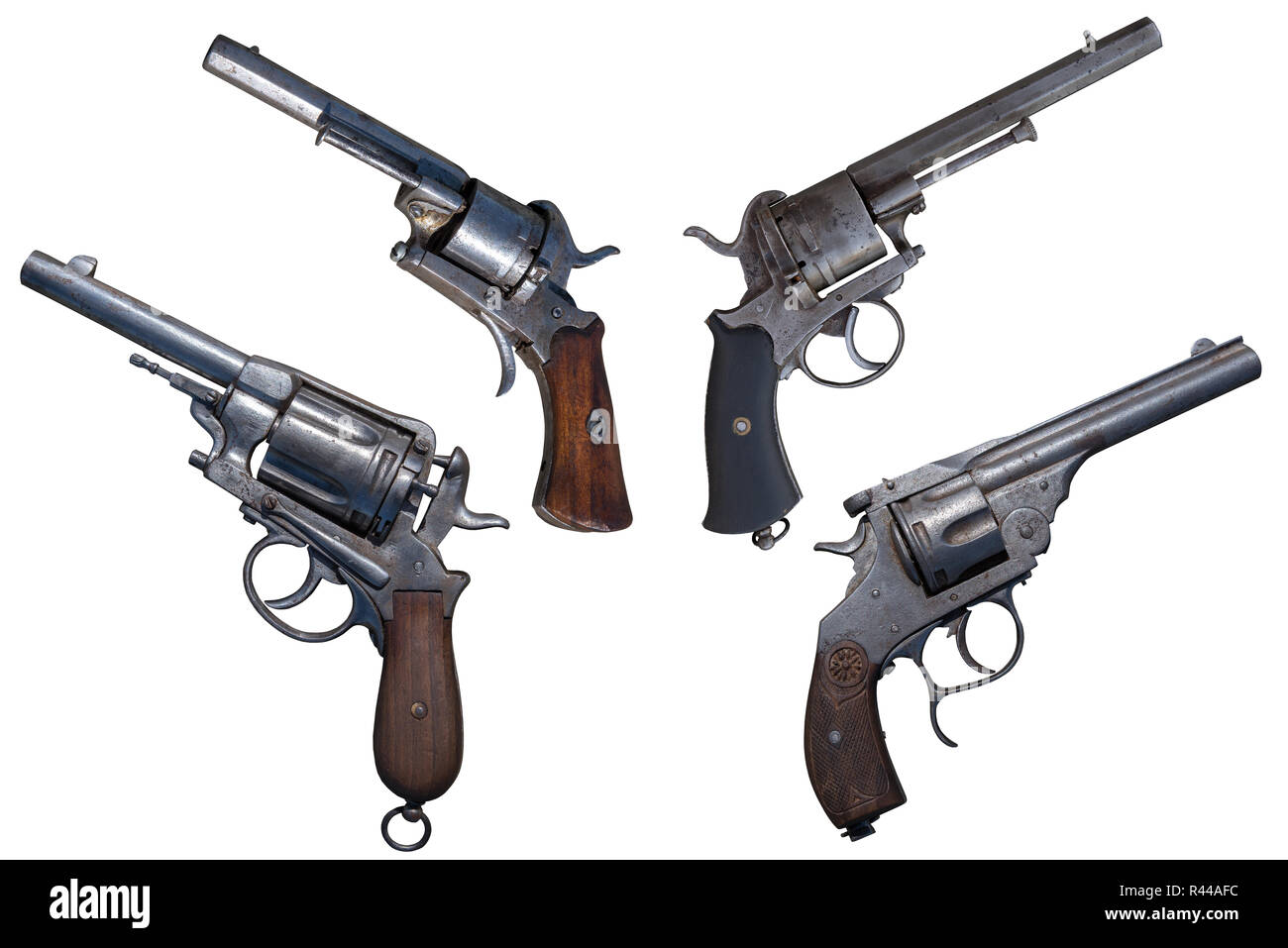 Ancient revolvers. Four old weapon isolated Stock Photo - Alamy