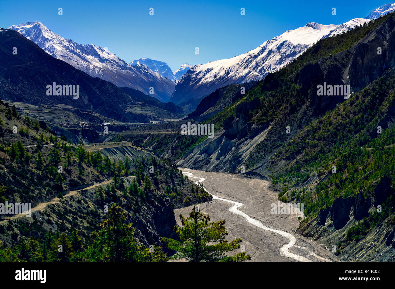 Himalayas mountain river valley with peaks in background, Nepal Stock ...