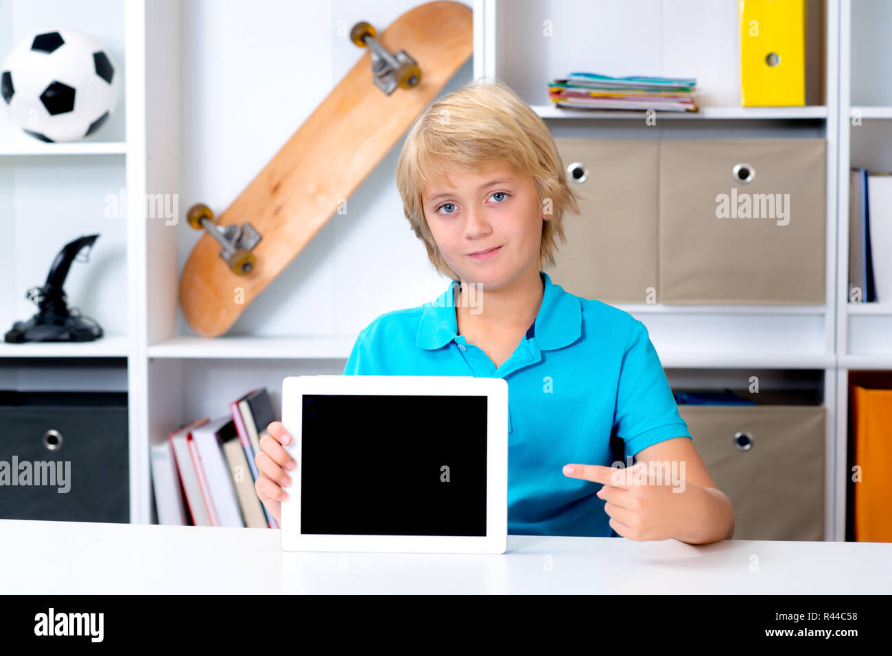 boy pointing of his tablet computer Stock Photo - Alamy
