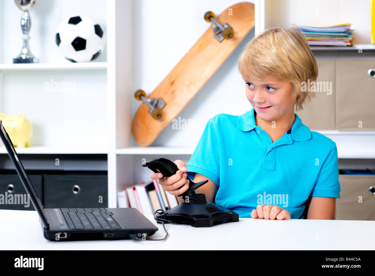 Teenage boy computer games laptop home hi-res stock photography and ...