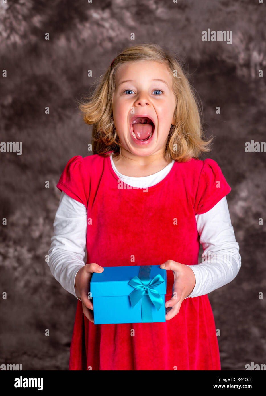 funny girl with present Stock Photo - Alamy
