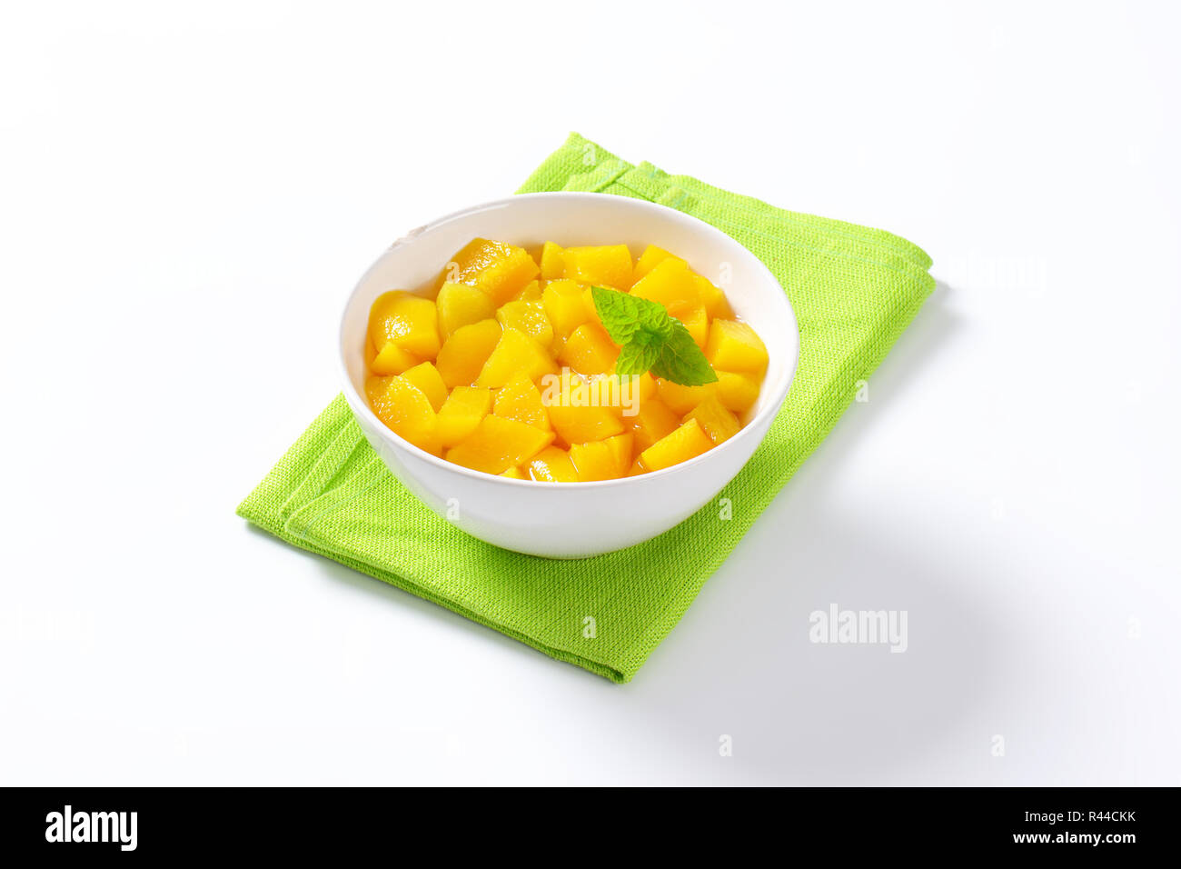 Canned peach pieces Stock Photo - Alamy