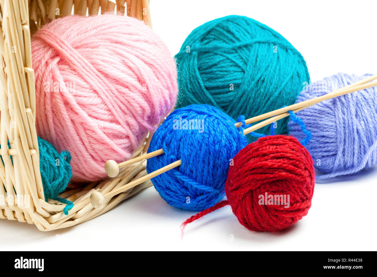 Colorful yarn balls falling on white background Stock Photo - Alamy