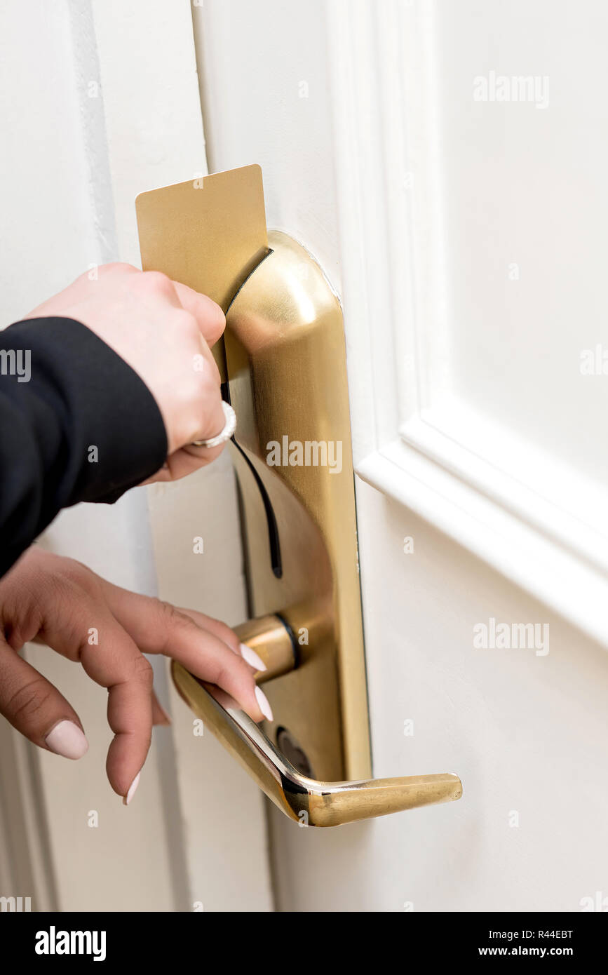 Woman opening door lock with an electronic card Stock Photo - Alamy